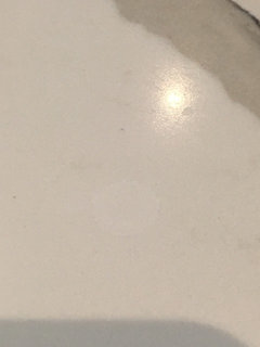 weird blemishes and cloudy areas on quartz countertop