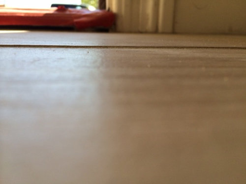 Help! Sharp edges on floor tiles after install.