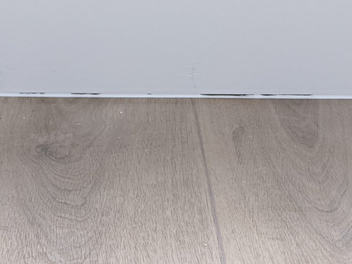 baseboards with vinyl flooring