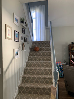 what should I hang on triangle wall - stairway?