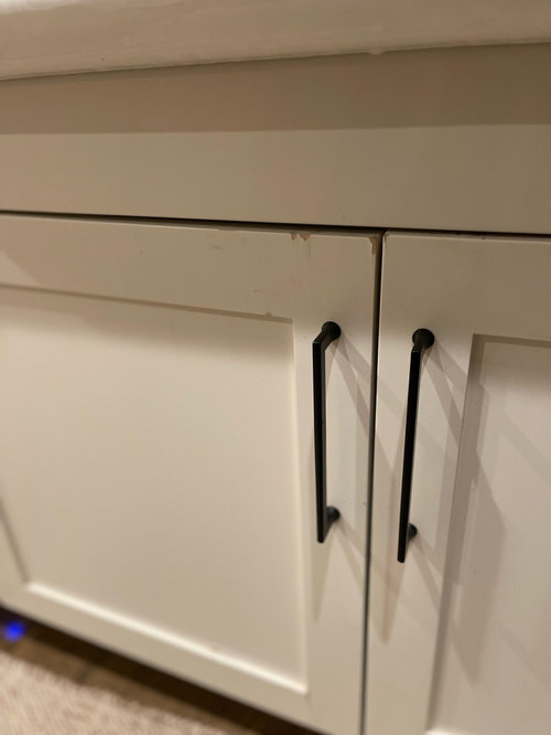 How does one repair these small cabinet blemishes?