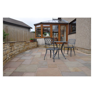 Autumn bronze sandstone patio with anstone walling - Traditional ...