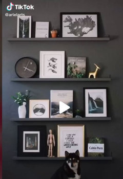 Large gallery wall behind computer desk