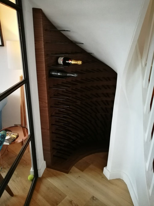 Curved Wine rack with metal strips.