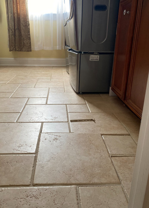 Tile delaminated from the FL washer