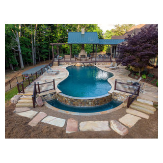 Luxury vanishing edge pool with copper scuppers - Rustic - Other - by ...