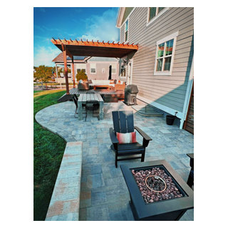Combination backyard project featuring deck, pergola, and patio pavers ...