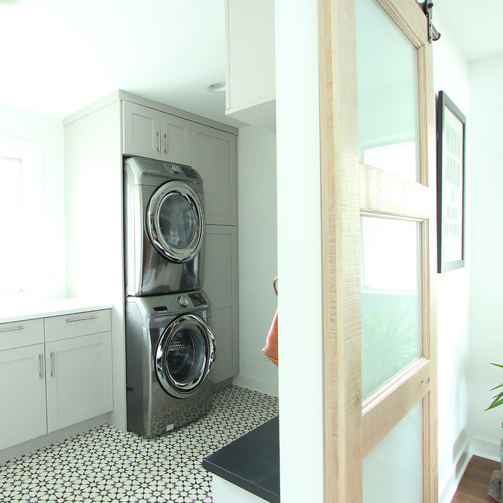 75 Beautiful Utility Room with a Stacked Washer and Dryer Ideas and ...