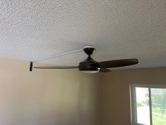 hiding a ceiling fan junction box and conduit on concrete ceiling