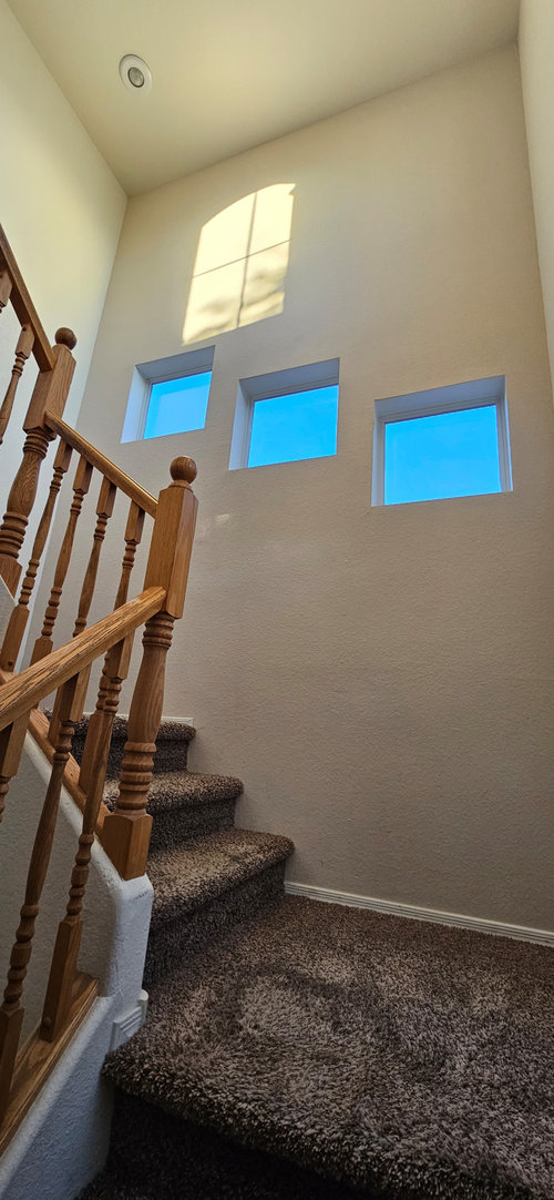 3 small windows in stairwell