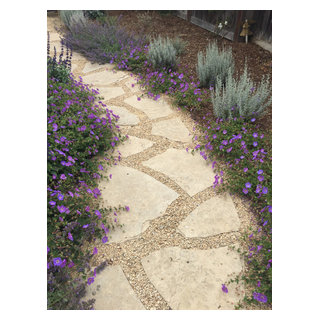Roxanne geraniums, germander sage, and catmint flank the flagstone and ...