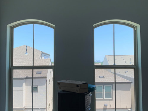 Tall arched windows in bedroom