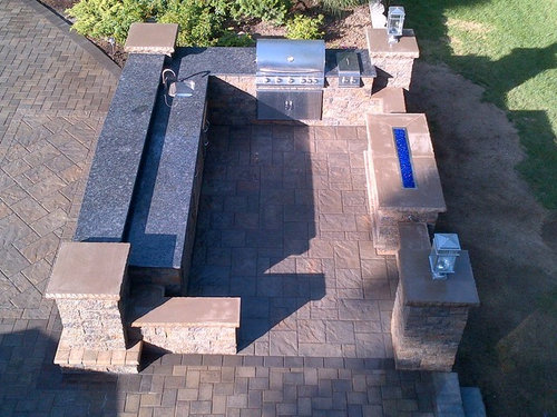 Techo-Bloc outdoor bar and kitchen with firewall