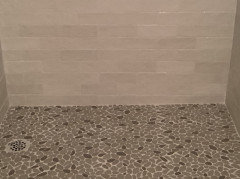 How to fix tile that is slanted with pitch of tile floor