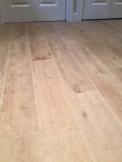 Bad tile installation or warped/bent tiles?