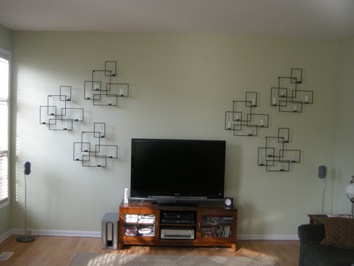 What do I put above the tv, between the sconces? Any ideas?