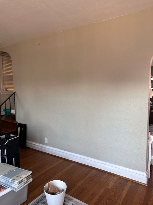 How to deal with double plaster arches in living room?