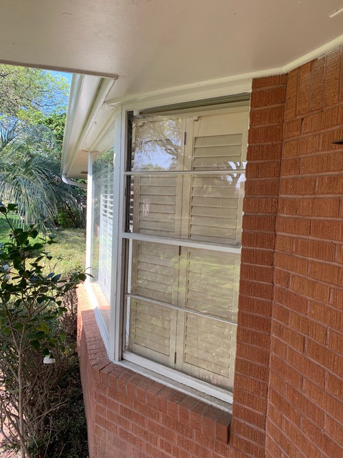 steel post hidden between windows?