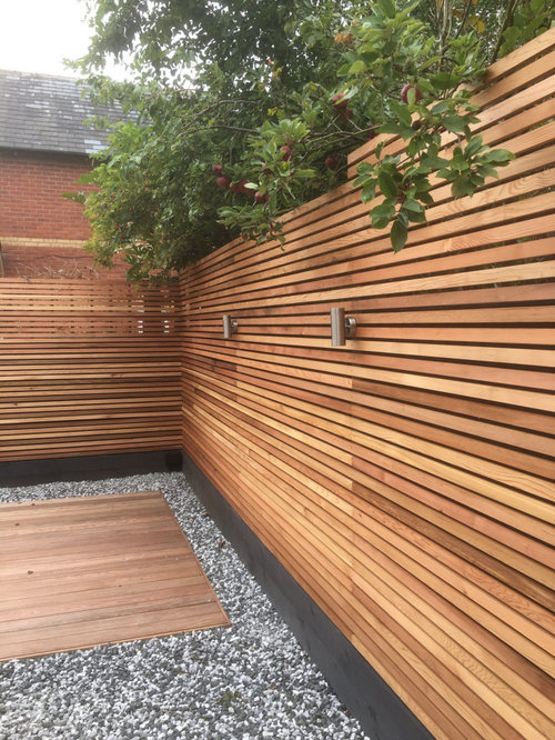 Creating an exterior timber feature wall over pebbledash, any advice ...