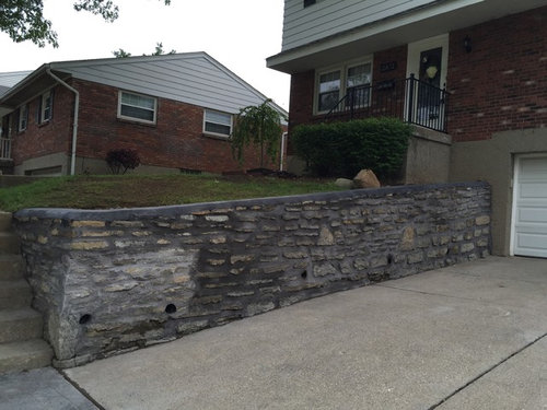Paint over stone retaining wall in driveway.