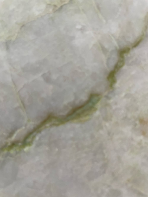 grey Taj Mahal quartzite countertop top turned green