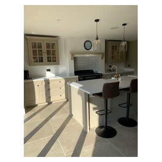 Traditional cream country cottage style kitchen with white worktops ...
