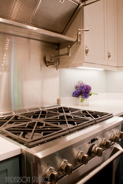 quartz floating shelf along one entire wall in kitchen