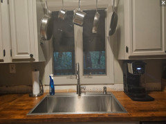 Backsplash placement with uneven window/cabinets