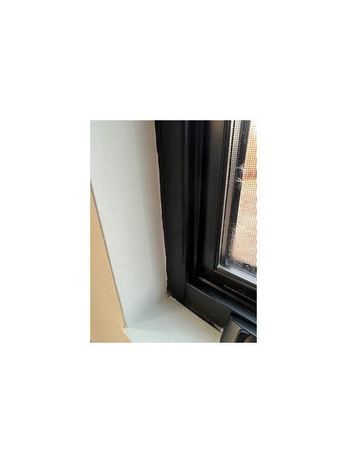 What is the cleanest way to caulk and paint around black windows?