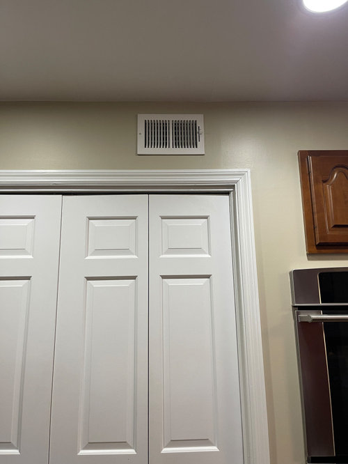 Air vent in crown moulding above cabinet?