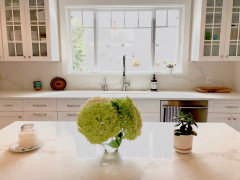 Quartz slab backsplash transition around/to window trim