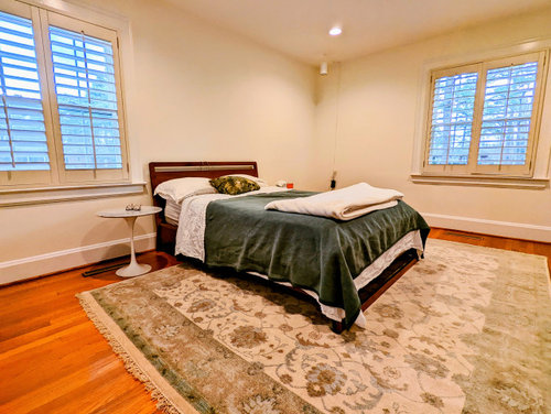 Design help for bedroom with off-center windows