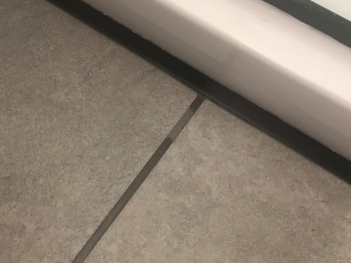 Help!! Dark grout spots on bathroom floor after ONE shower!