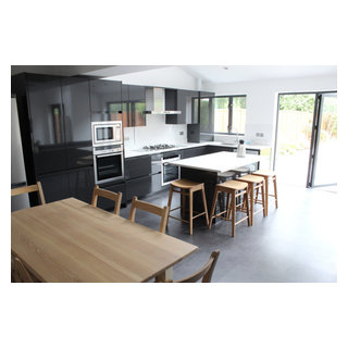 Sleek Modern Black Kitchen with Island by Kudos Interior Design ...