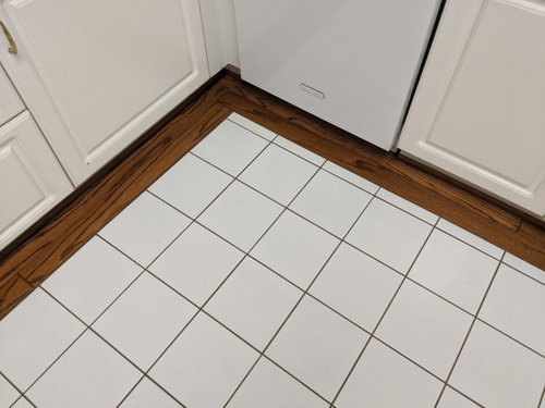 Kitchen Flooring - Rip out or go over top?