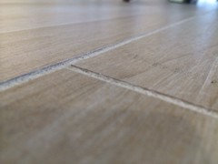 Help! Sharp edges on floor tiles after install.