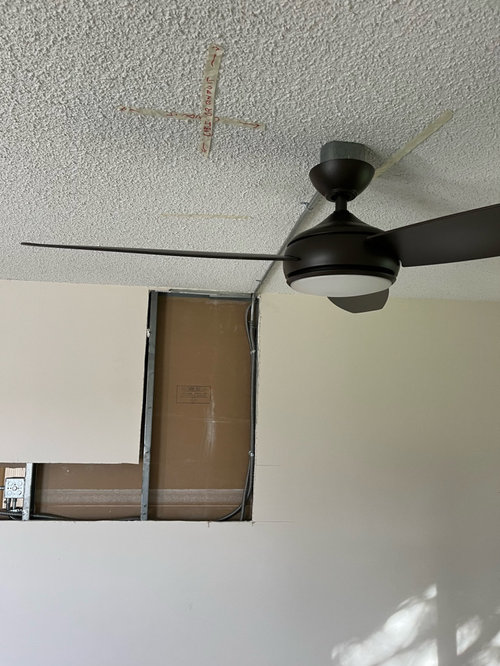 hiding a ceiling fan junction box and conduit on concrete ceiling