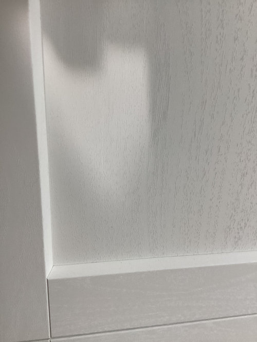 Enkoping doors and quartz counter solid or veining.
