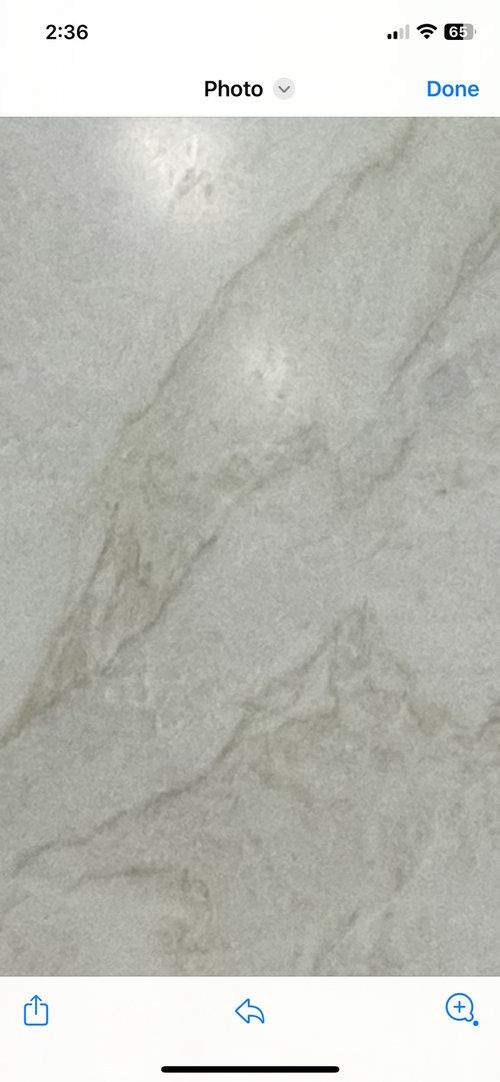 grey Taj Mahal quartzite countertop top turned green