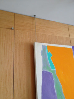 How to hang heavy art without drilling into wood
