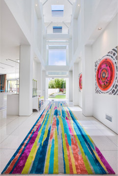 Positioning of 2 runner rugs in L-shaped hallway? Does it matter?