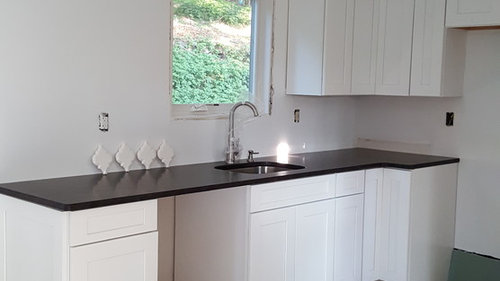 Granite counter installed with shims - problem?