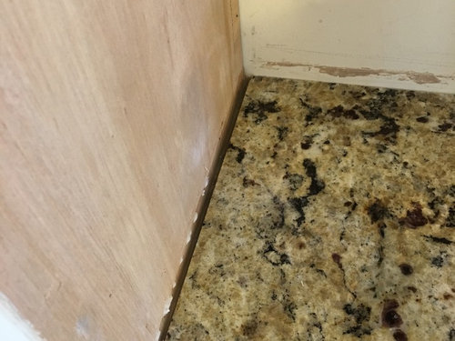 Gap on the side of new granite counter and cabinet!