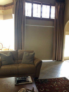 ideas to redesign room. 14 ft ceilings. Two walls floor to ceiling win