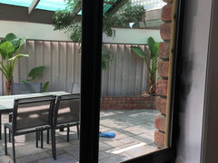 Primrose window frames and charcoal grey floor tiles | Houzz AU