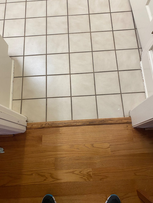 What flooring for kitchen when adjoining rooms are hardwood?