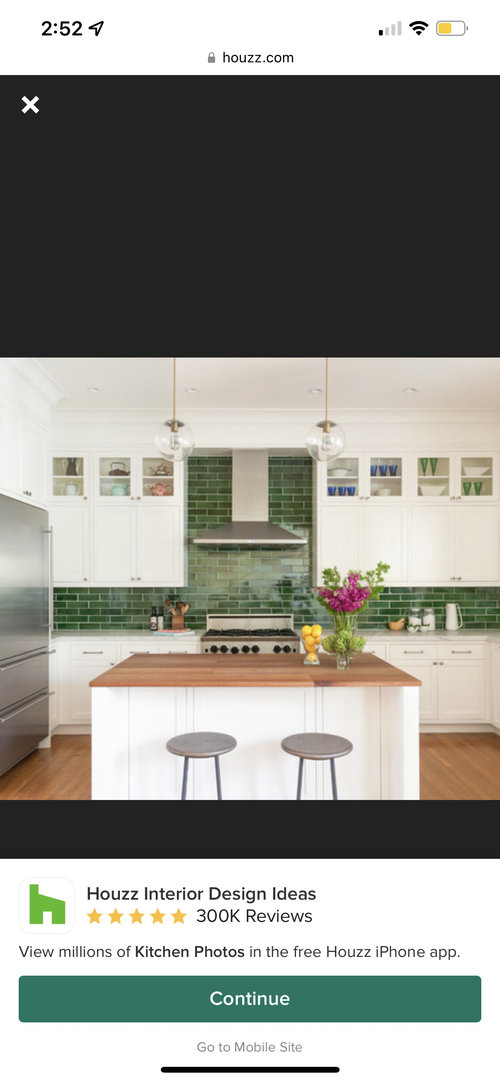 White kitchen cabinets with ugly tan tile floor?