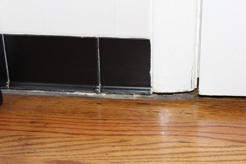 How do I fix this gap between kitchen floor and wall tile?
