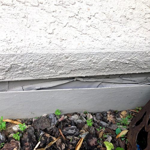 What to use to replace this “trim” around house footing?