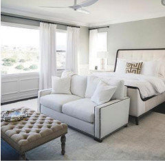 Asymmetrical window on bedroom wall